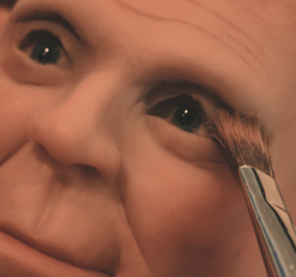 Painting the face and correcting errors.