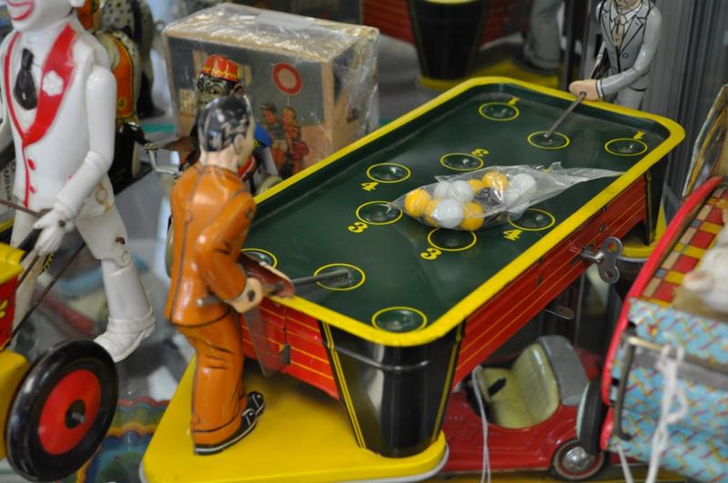 A skeleton rocking chair from the Estate of Vincent Price, tin toys and ...